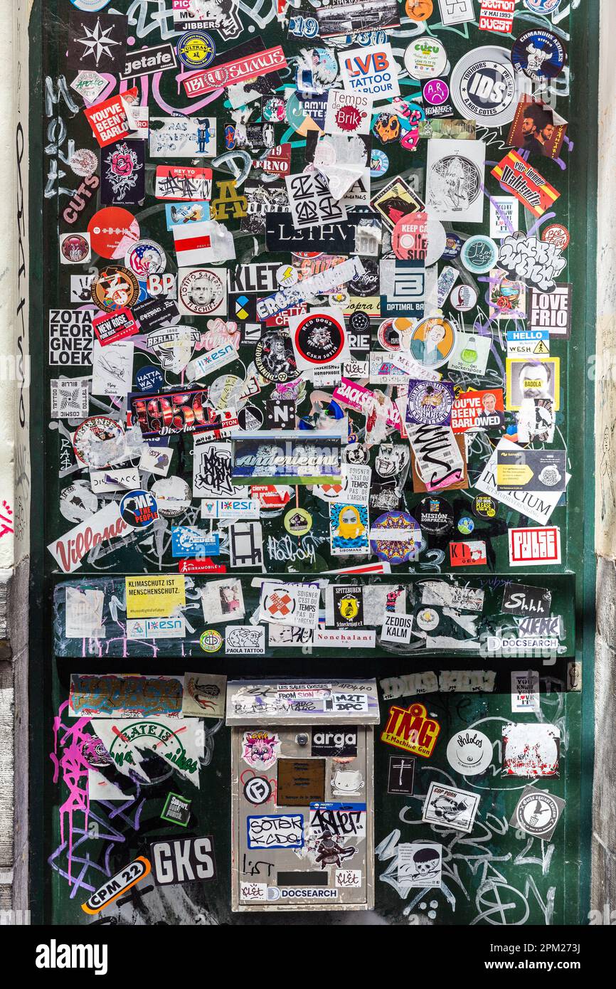 Street door completely covered with stickers. Brussels Stock Photo - Alamy