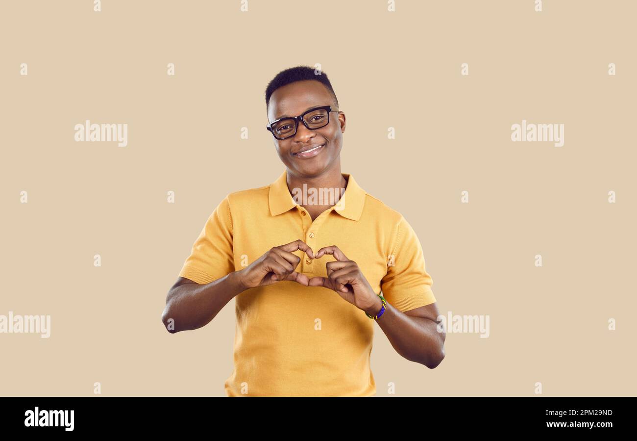 African american man shows love hi-res stock photography and images - Alamy