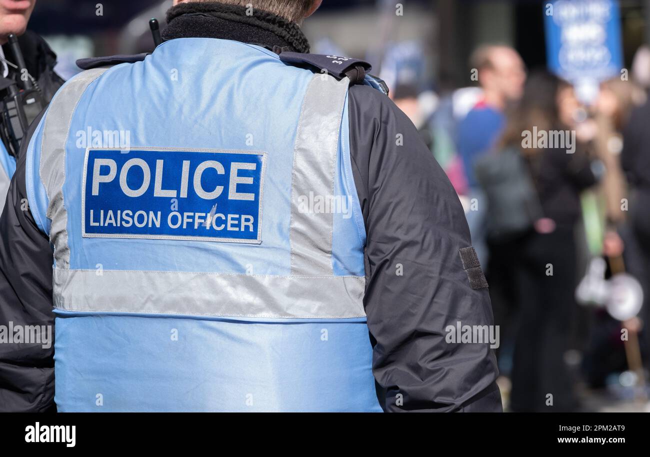 London, UK. 11th March 2023. British Police Liaison Officer monitoring ...