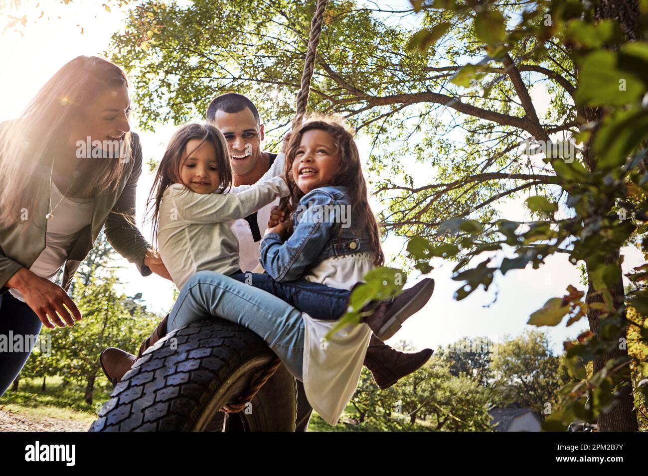 Making family memories. a happy mother and father pushing their ...