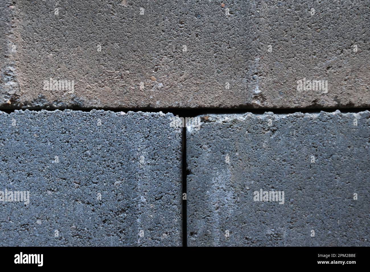 Gray building cinder blocks made of cement stacked close-up background ...