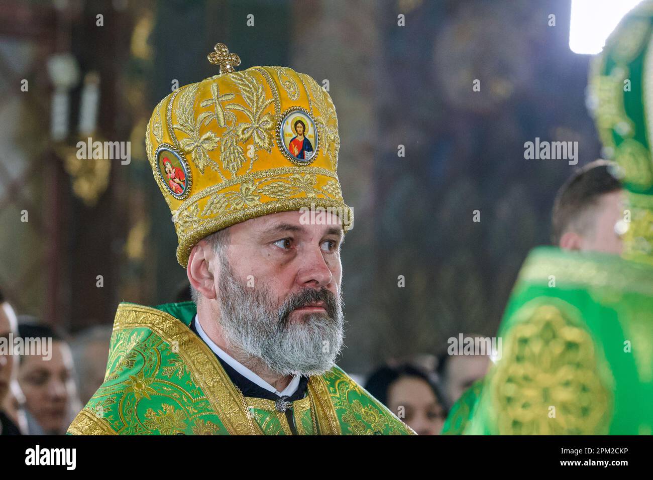 Non Exclusive: KYIV, UKRAINE - APRIL 9, 2023 - A priest partakes in the ...