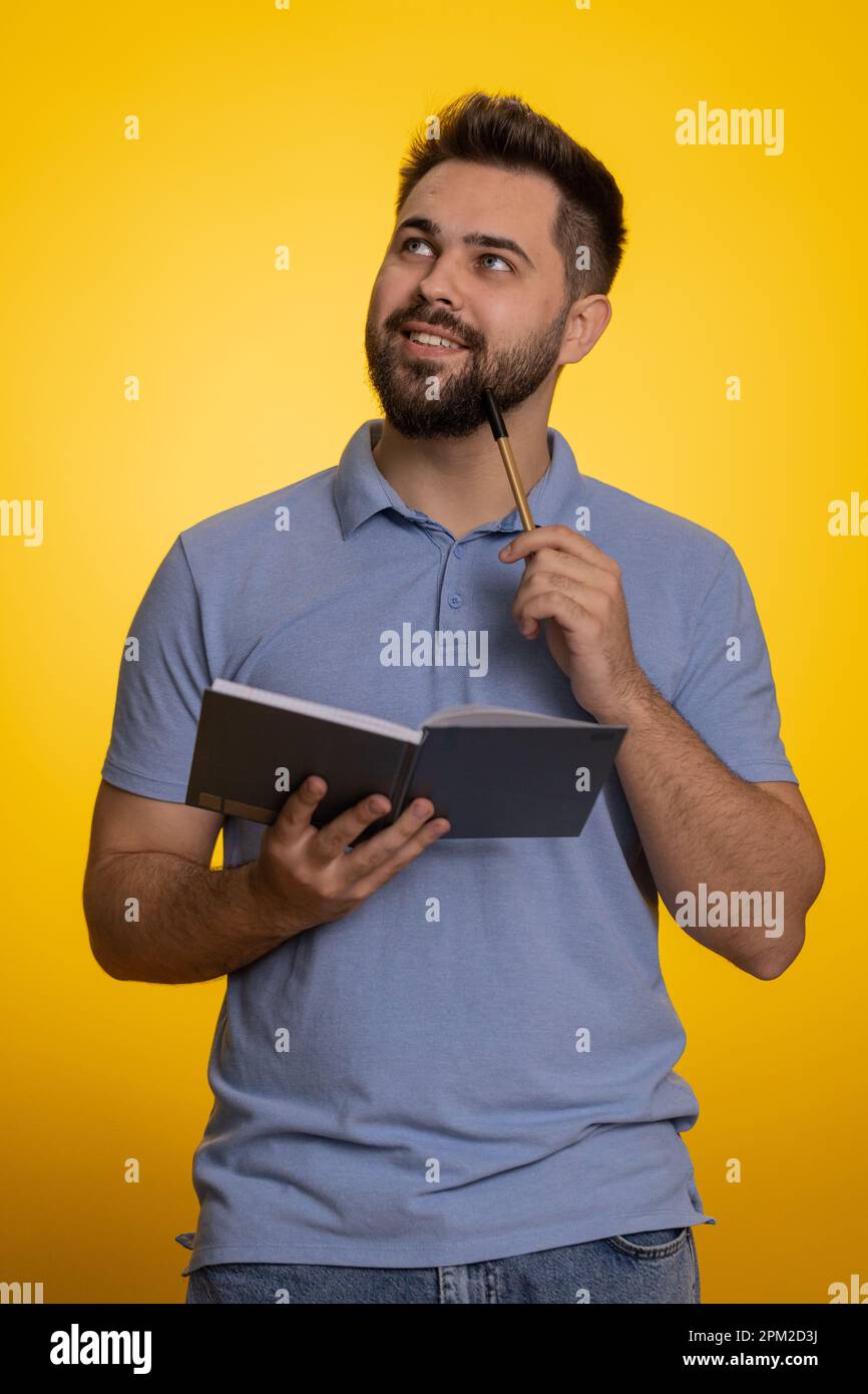 Attractive student guy making notes hi-res stock photography and images ...