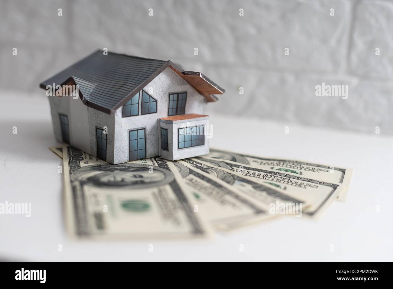 Money house isolated on white background Stock Photo - Alamy