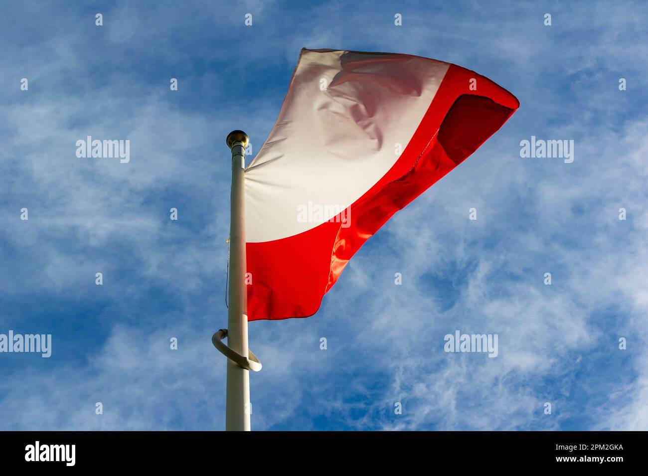 Polish flag waving in wind at sunset and nice blue sky Stock Photo - Alamy