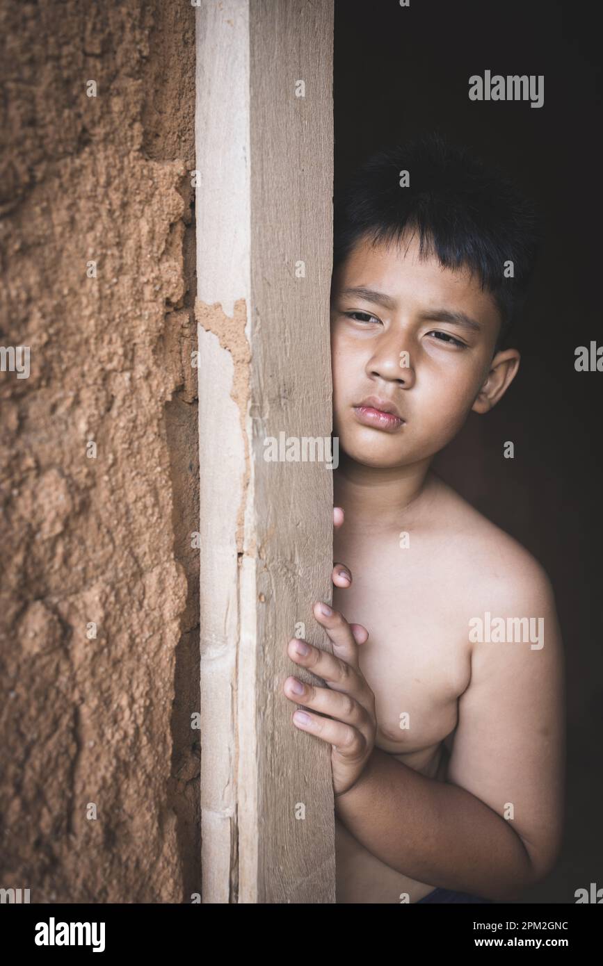 Portrait of a poor little thailand boy lost in deep thoughts, poverty, Poor children, War ...