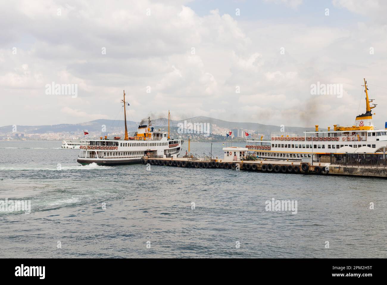 Ships near pier with princess islands and Istanbul at background in ...