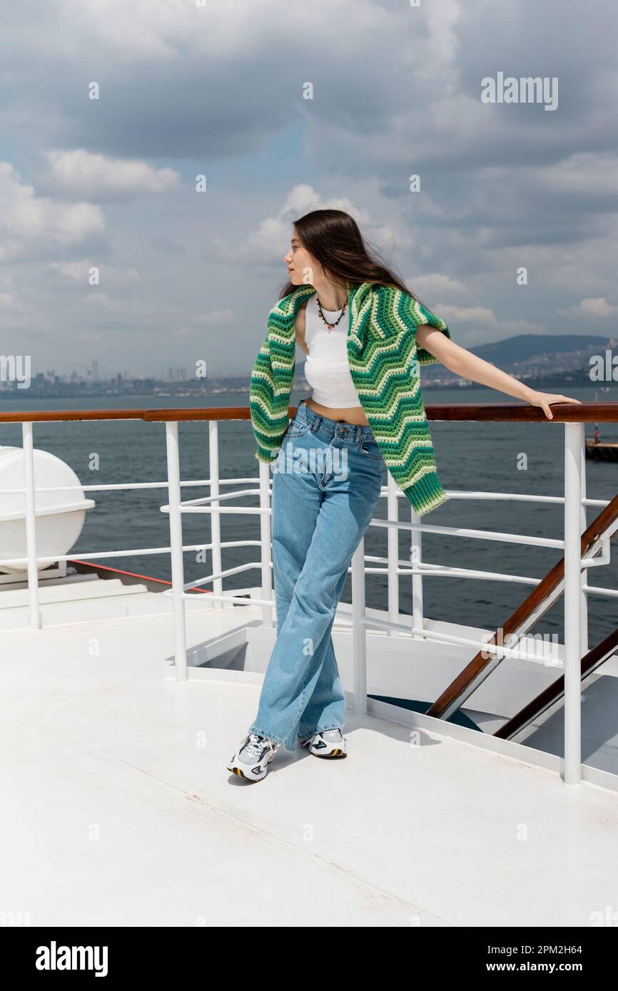 Woman standing coast looking sea sailing ship hi-res stock photography ...