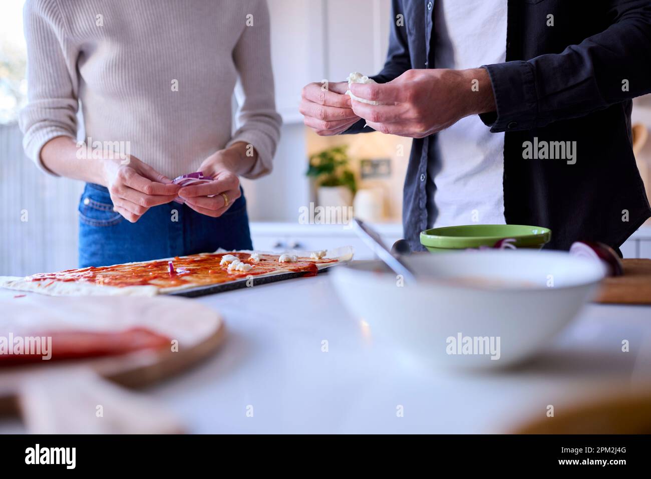 Close up couple making pizza hi-res stock photography and images - Alamy