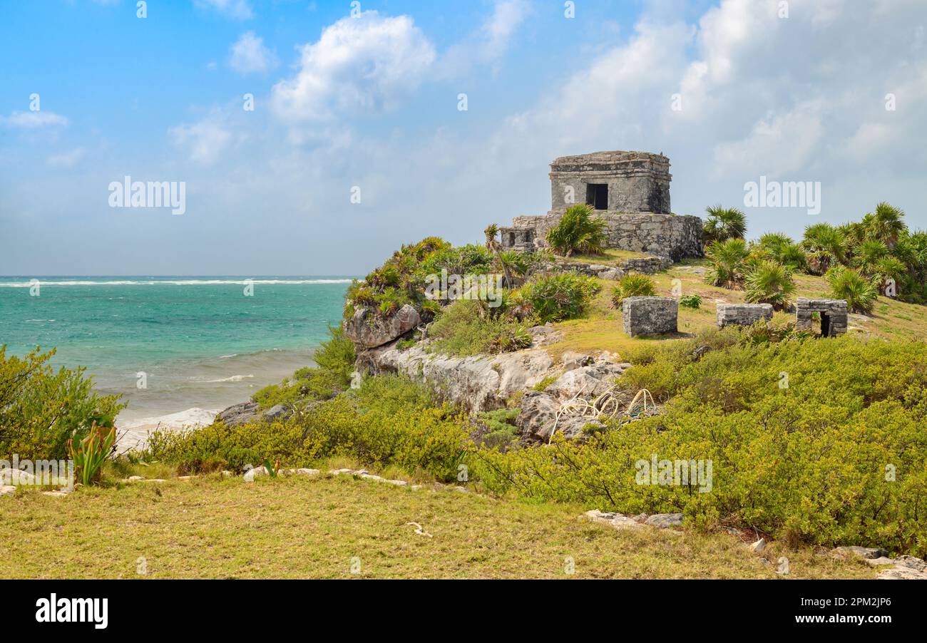The Tulum Ruins on a cliff next to the Ocean Stock Photo - Alamy