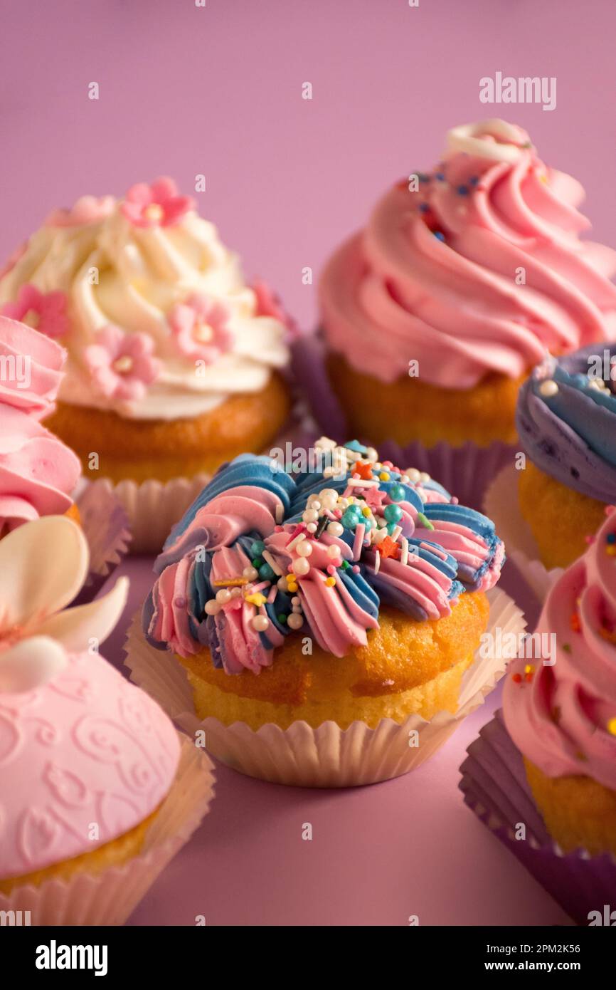 A variety of colorful cupcakes with various types of frosting Stock ...