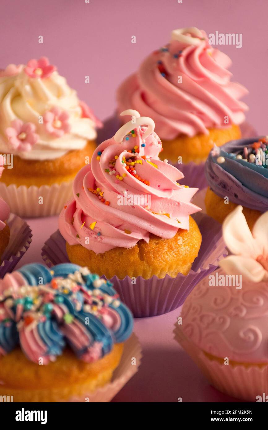A variety of colorful cupcakes with various types of frosting Stock ...