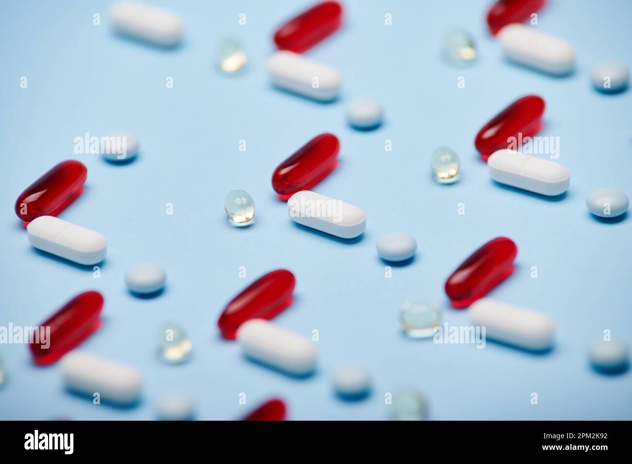 Macro shot of medical pills, dragees and capsules laid out in pattern ...