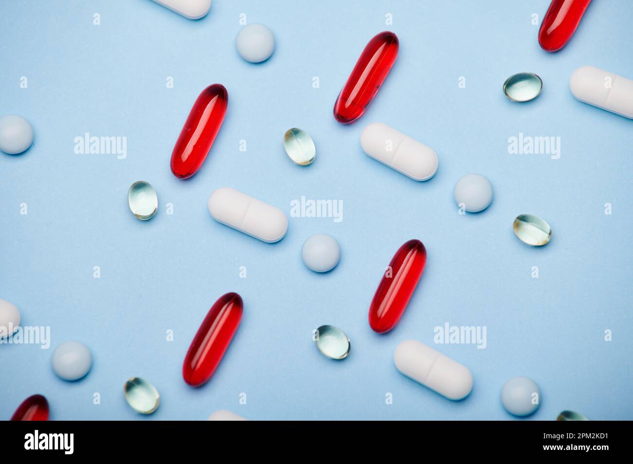 Flat lay. Background of medical pills, tablets, gel capsules and ...