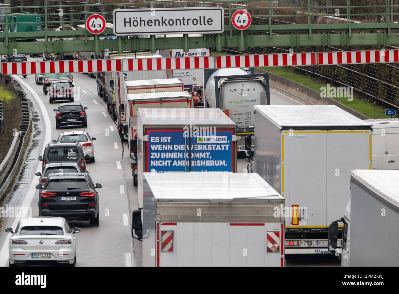 Karlsfeld, Germany. 11th Apr, 2023. Cars and trucks are stuck in a ...