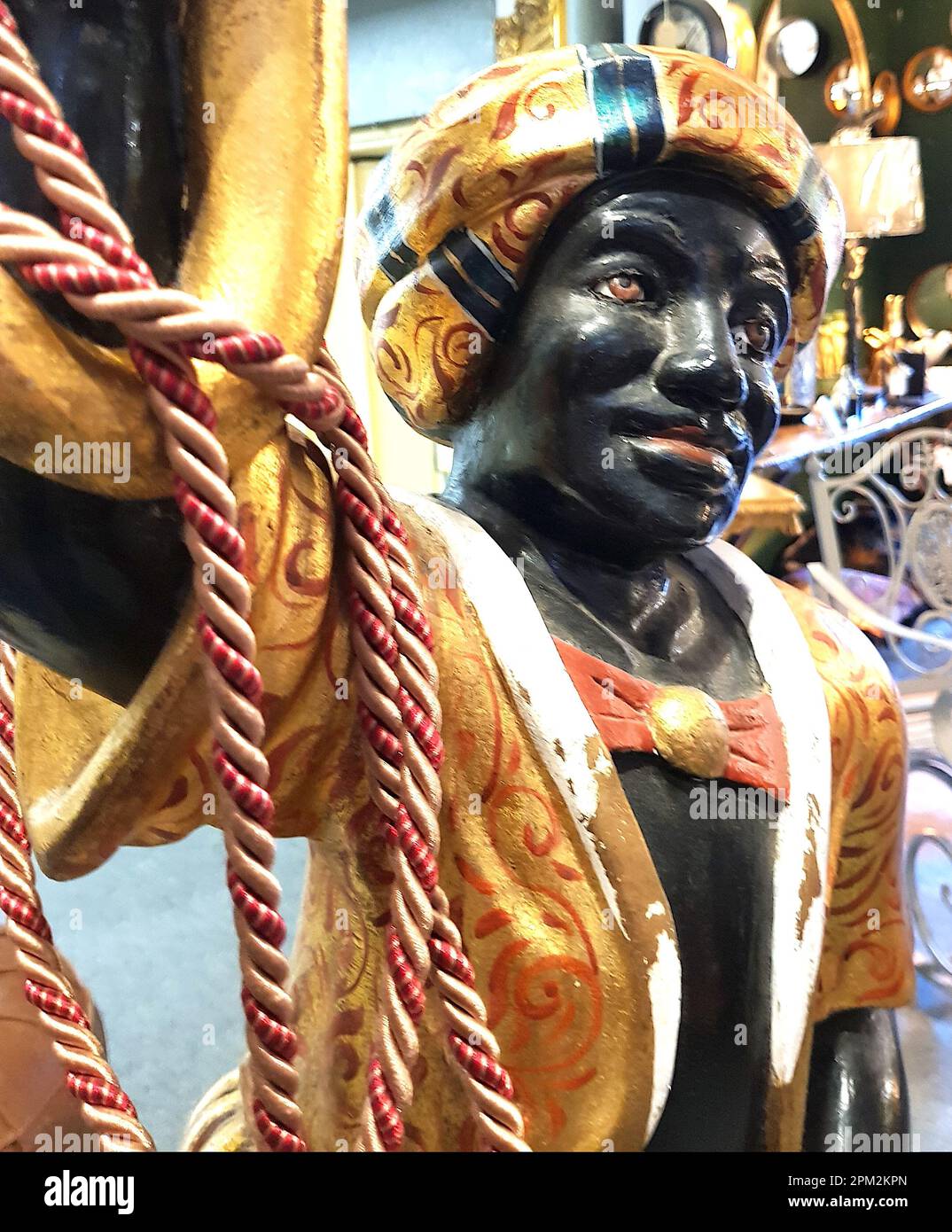 Statue of a man dressed in an exotic outfit Stock Photo - Alamy