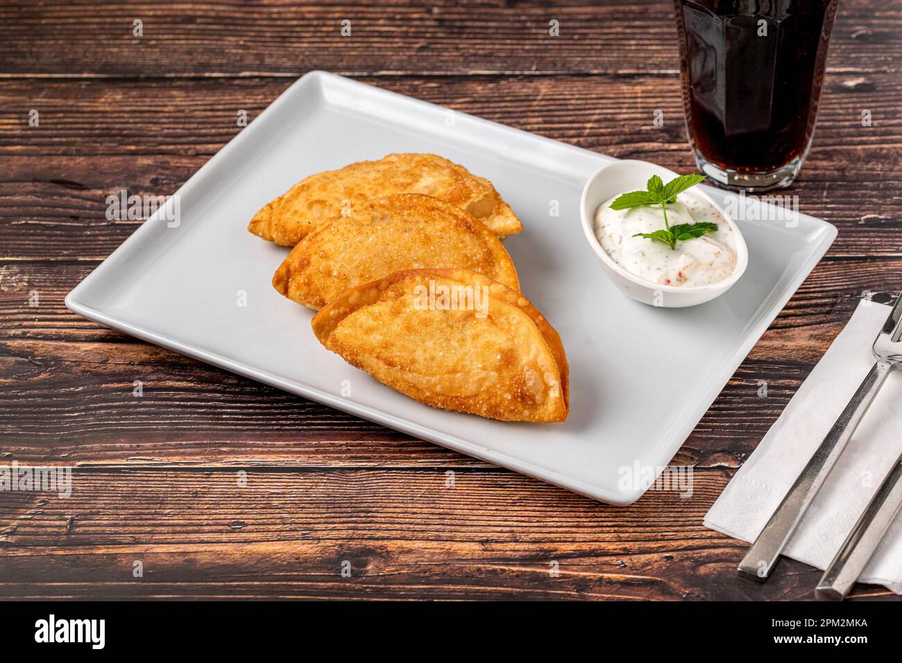Beef Cheburek on a wooden table. Deep Fried Beef Dumplings with meat ...