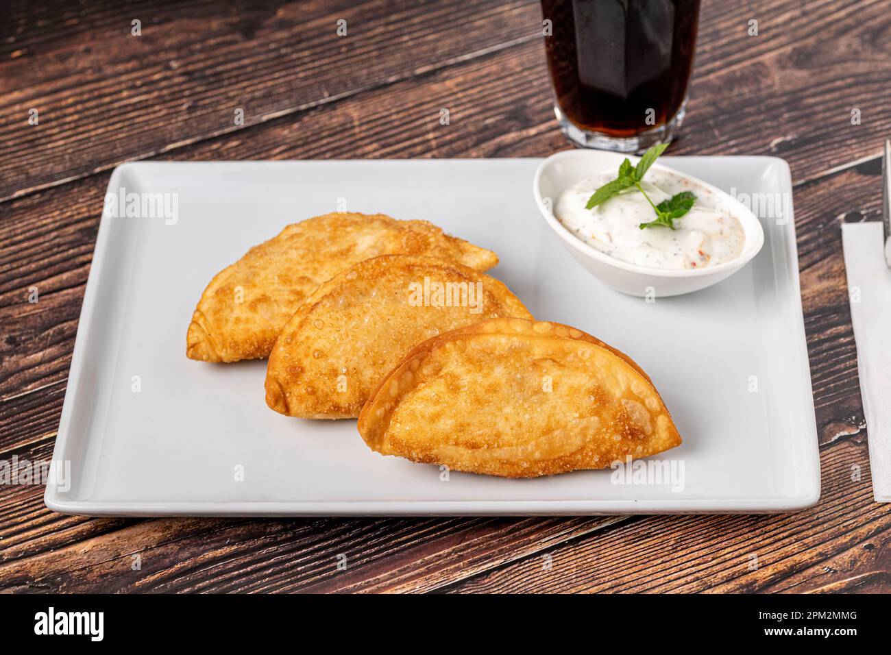 Beef Cheburek on a wooden table. Deep Fried Beef Dumplings with meat ...