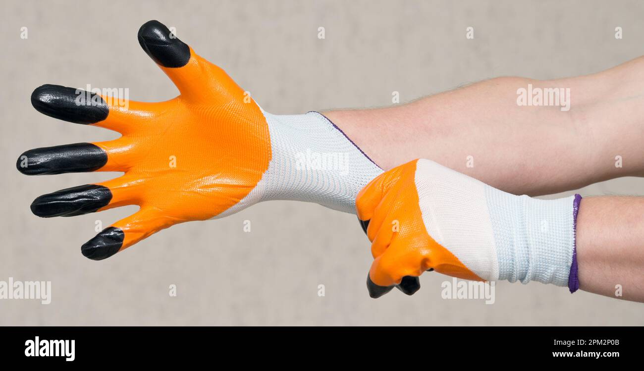 Hands wear hi-res stock photography and images - Alamy