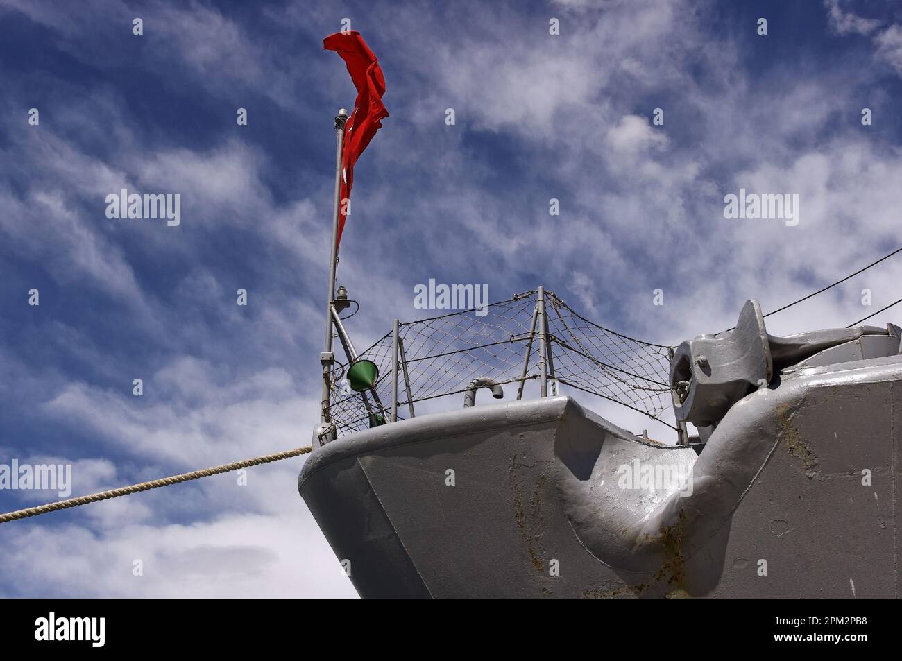 Red flag waving in the wind on the deck of a boat Stock Photo - Alamy