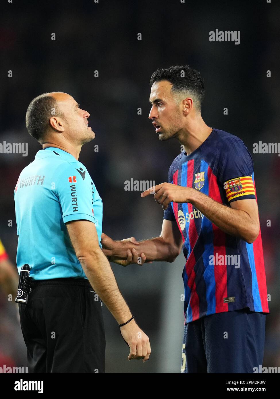 Sergio Busquets of FC Barcelona speaks with the referee Antonio Mateu ...