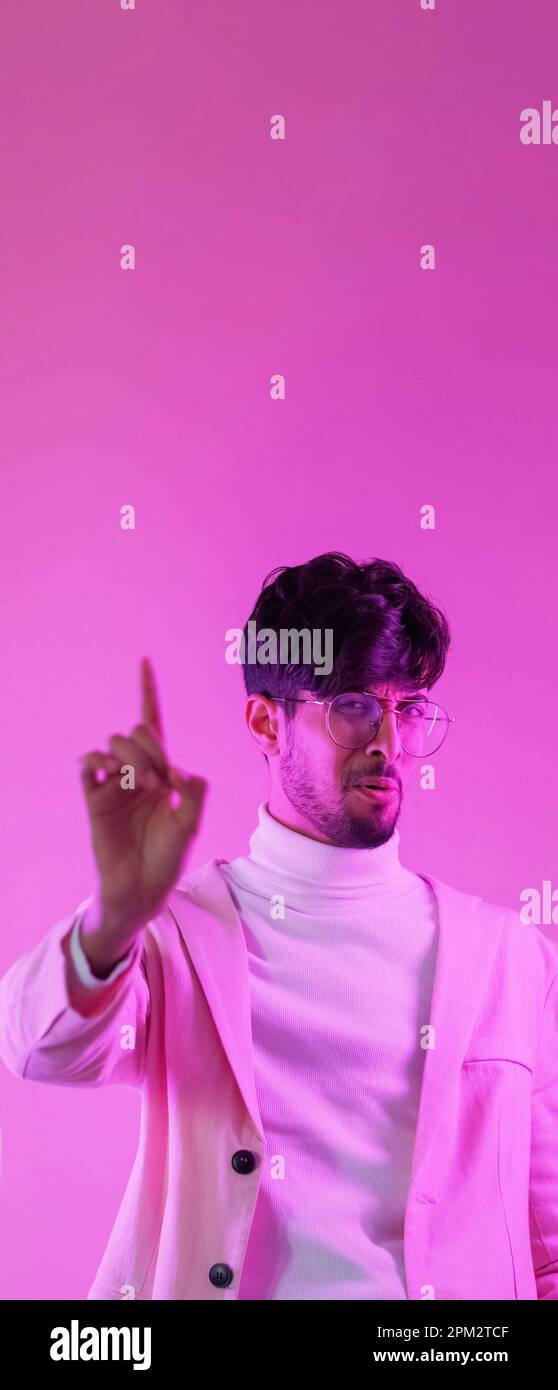 Warning no objection gesture pink neon skeptic man Stock Photo - Alamy