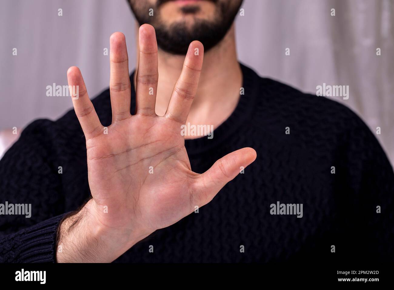 Young man showing palm with five fingers. Concept of stop. five fingers ...