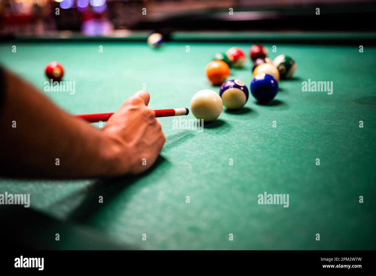 Young man playing snooker, aiming. for a good shot Stock Photo - Alamy