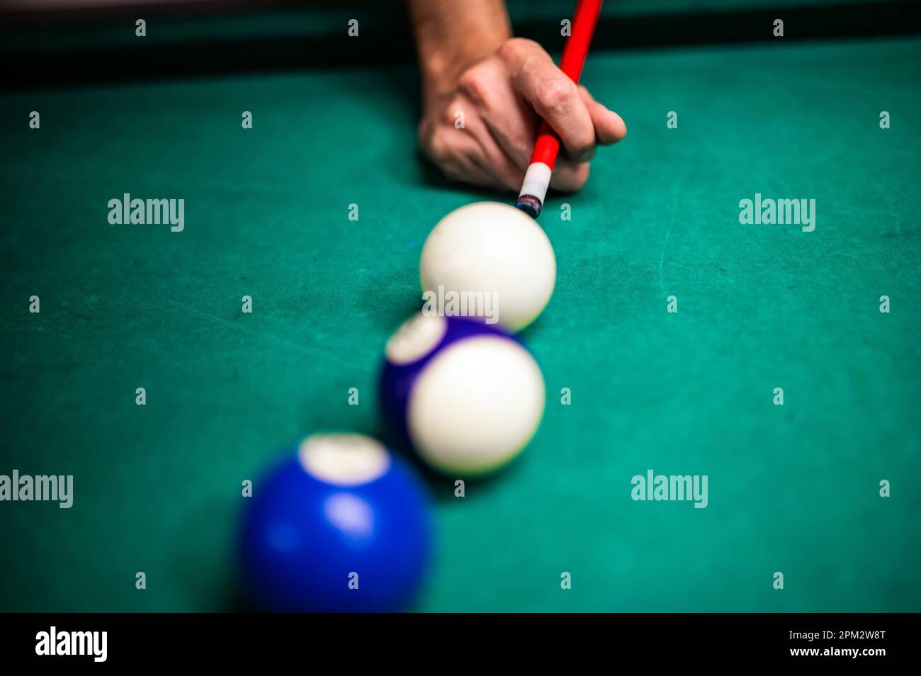 Young man playing snooker, aiming. for a good shot Stock Photo - Alamy