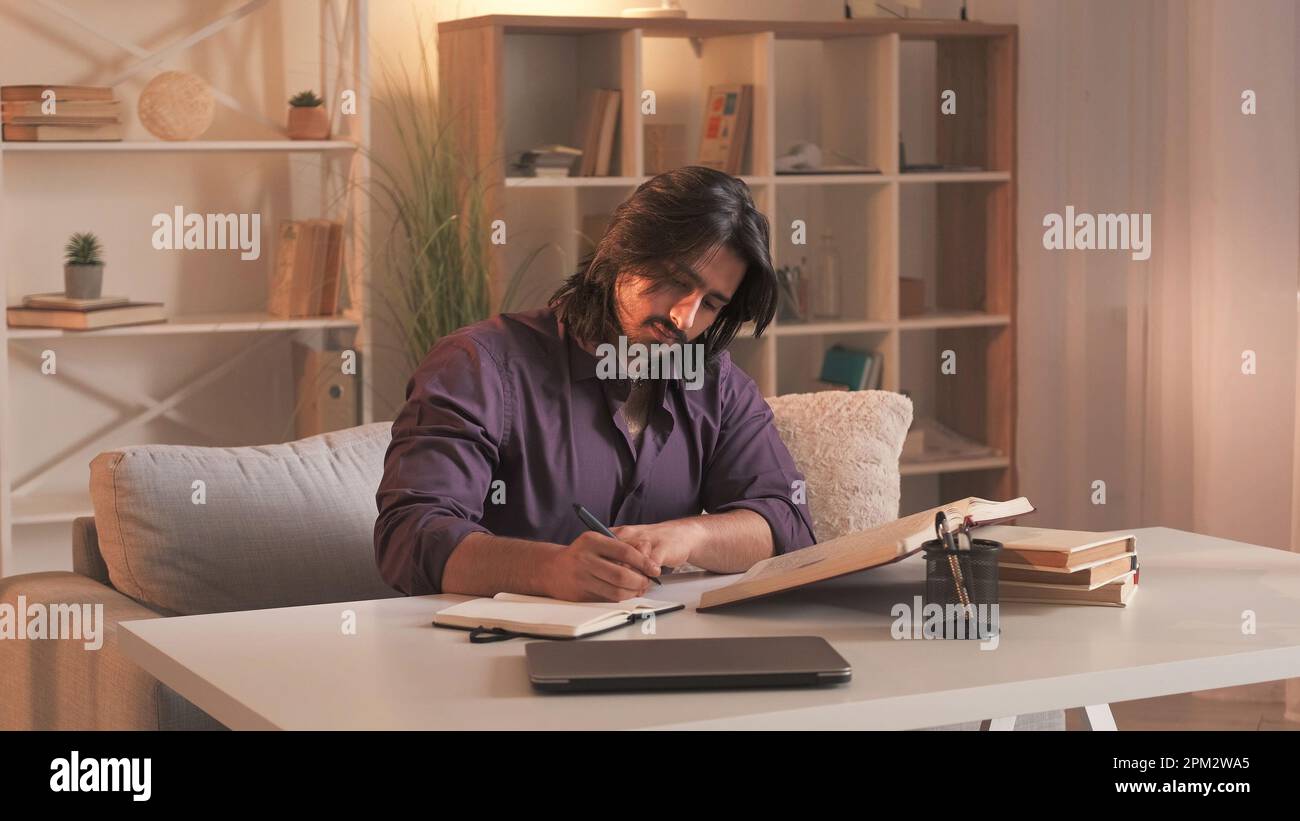 Home learning scholarship study man books notes Stock Photo - Alamy
