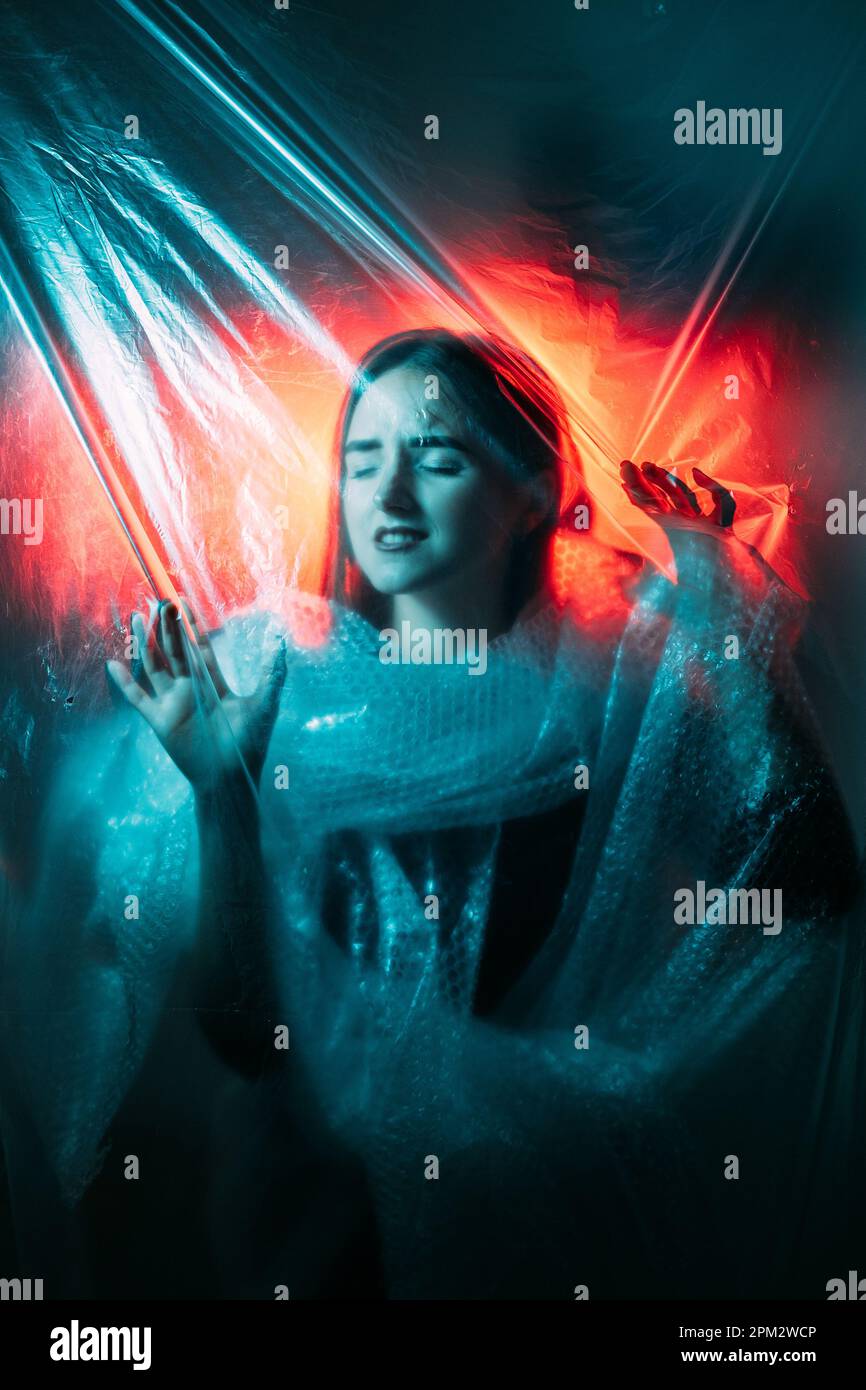 Plastic pollution global warming woman bubble wrap Stock Photo - Alamy