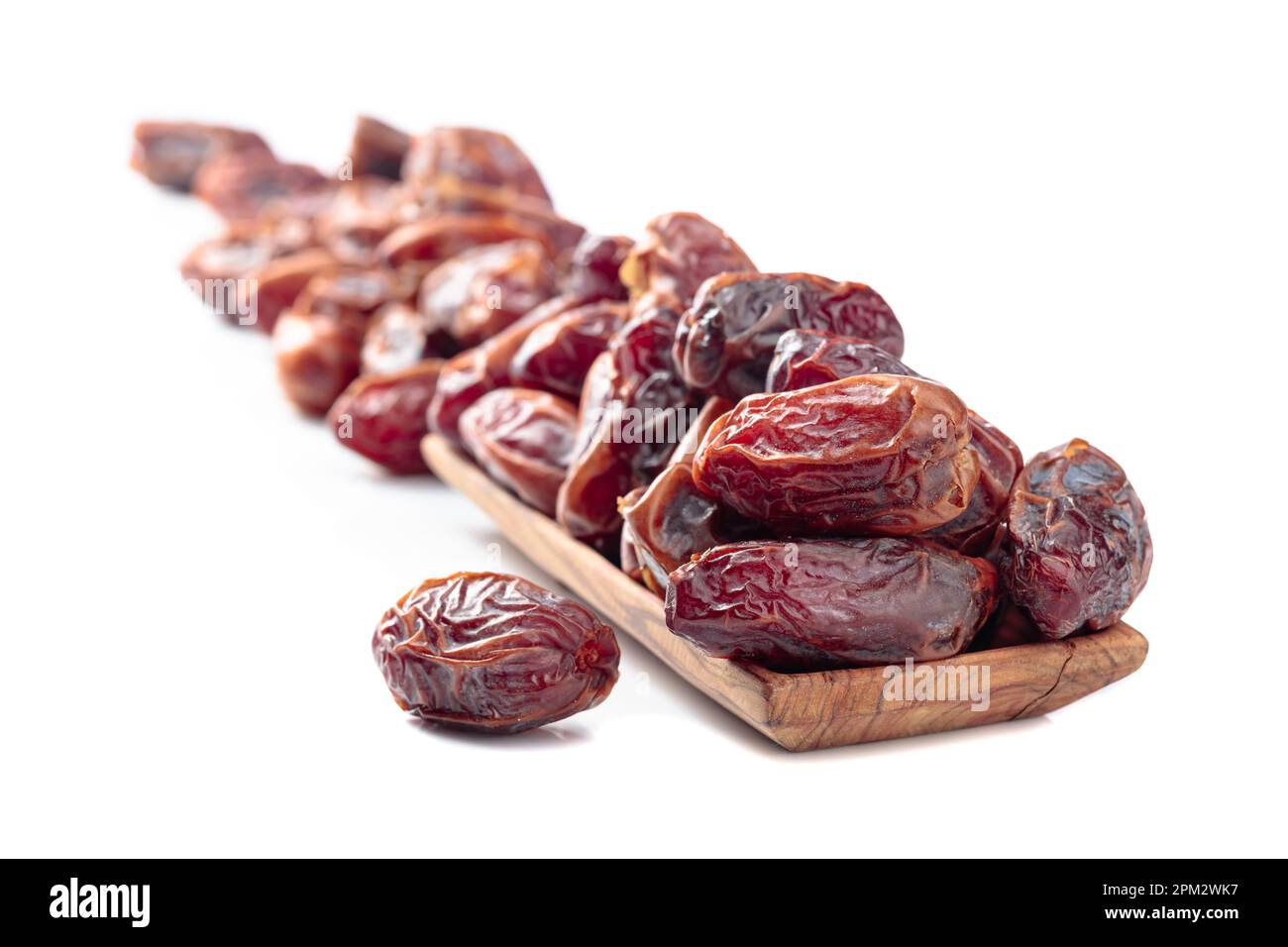 Arabic dates in a wooden dish isolated on a white background Stock ...