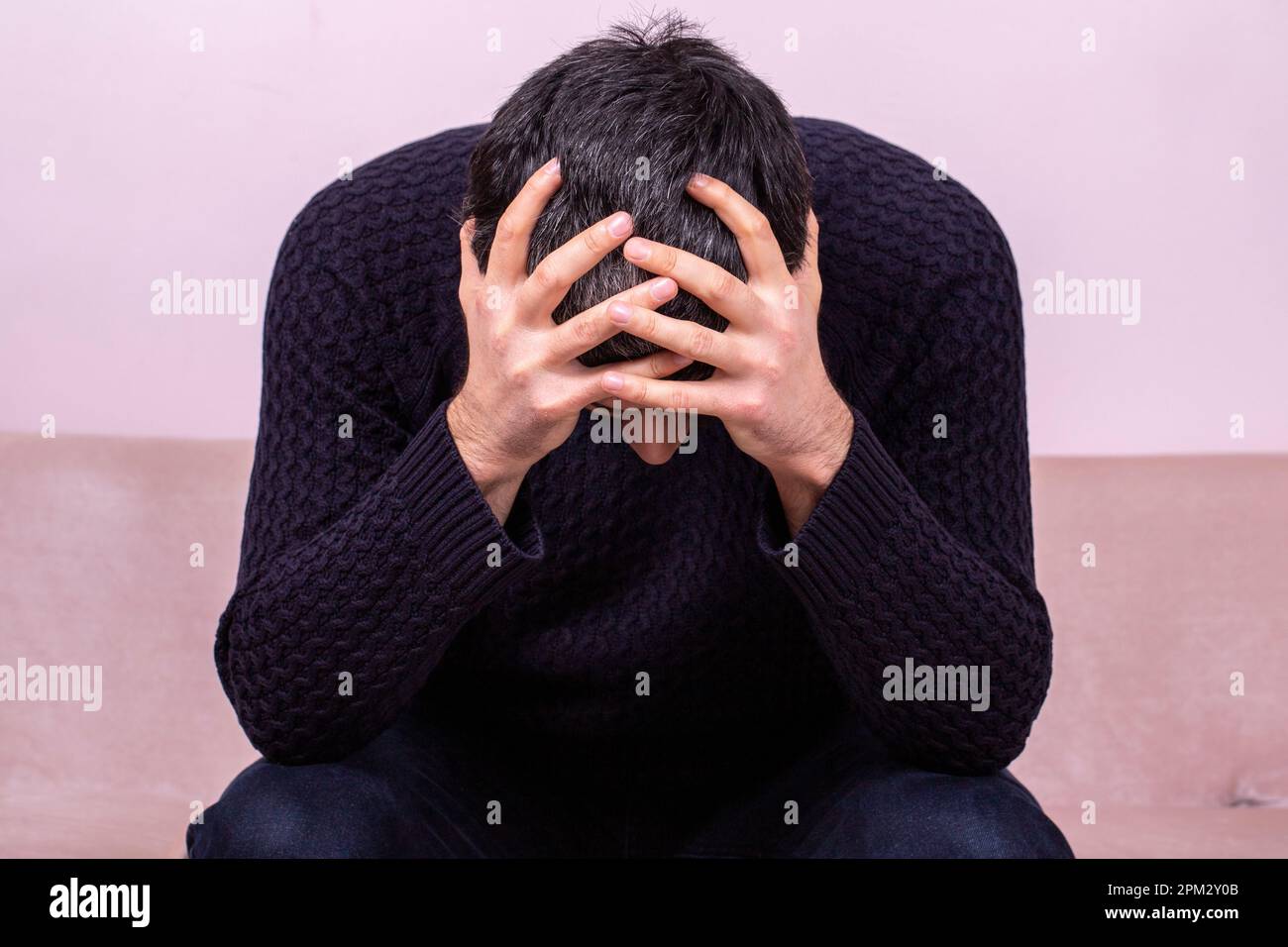 Boy sitting head down sad hi-res stock photography and images - Alamy