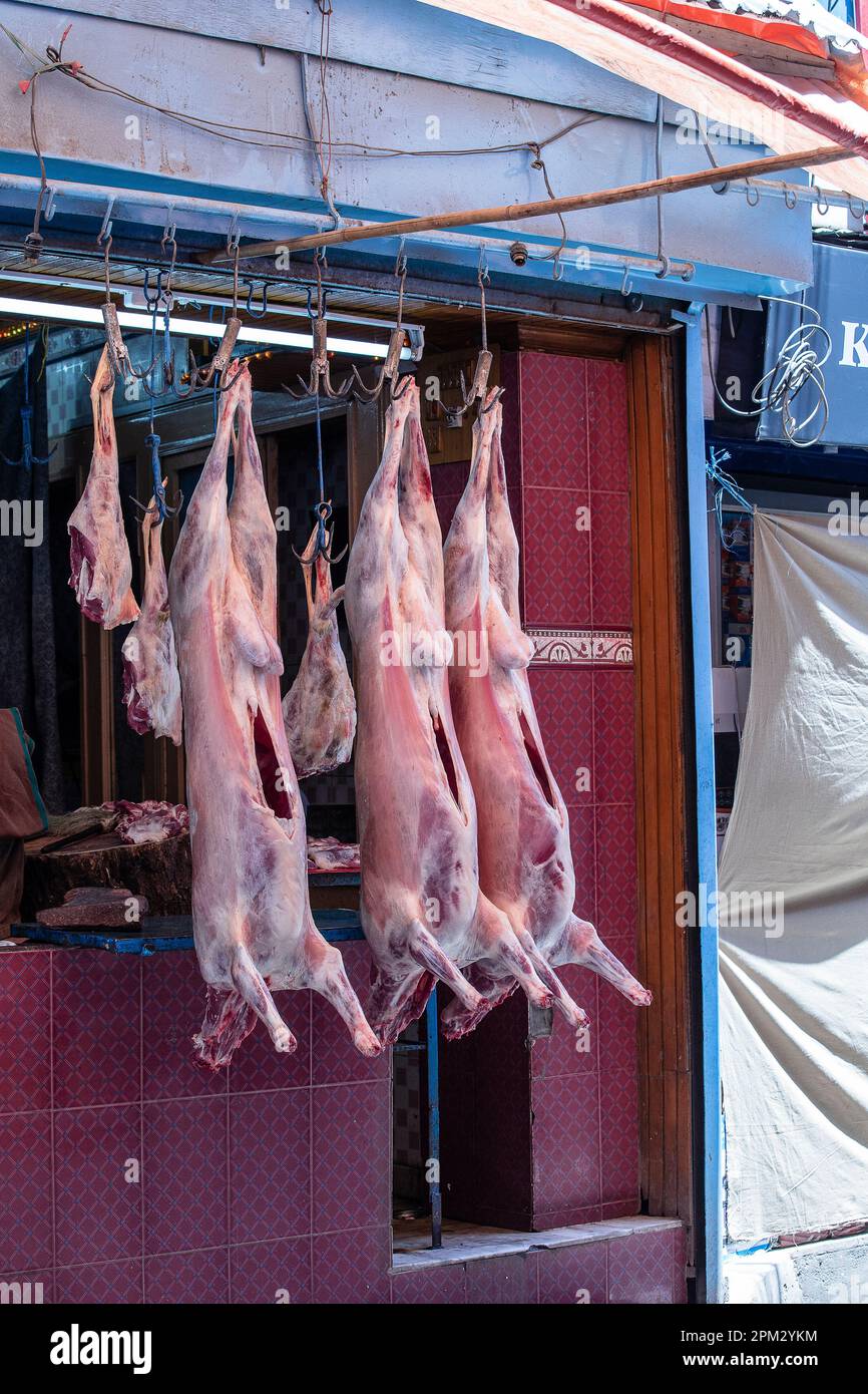 Ram Carcass Hanging On A Hook And Is Being Prepared For Sale Showcase Of A Butchers Shop With