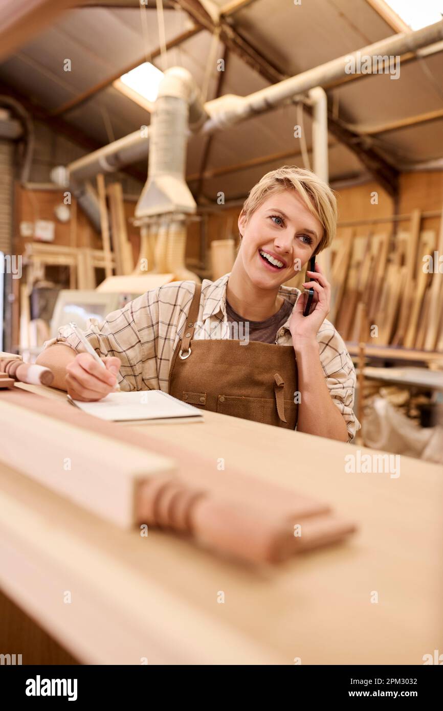 Female Apprentice Working As Carpenter In Furniture Workshop Making ...