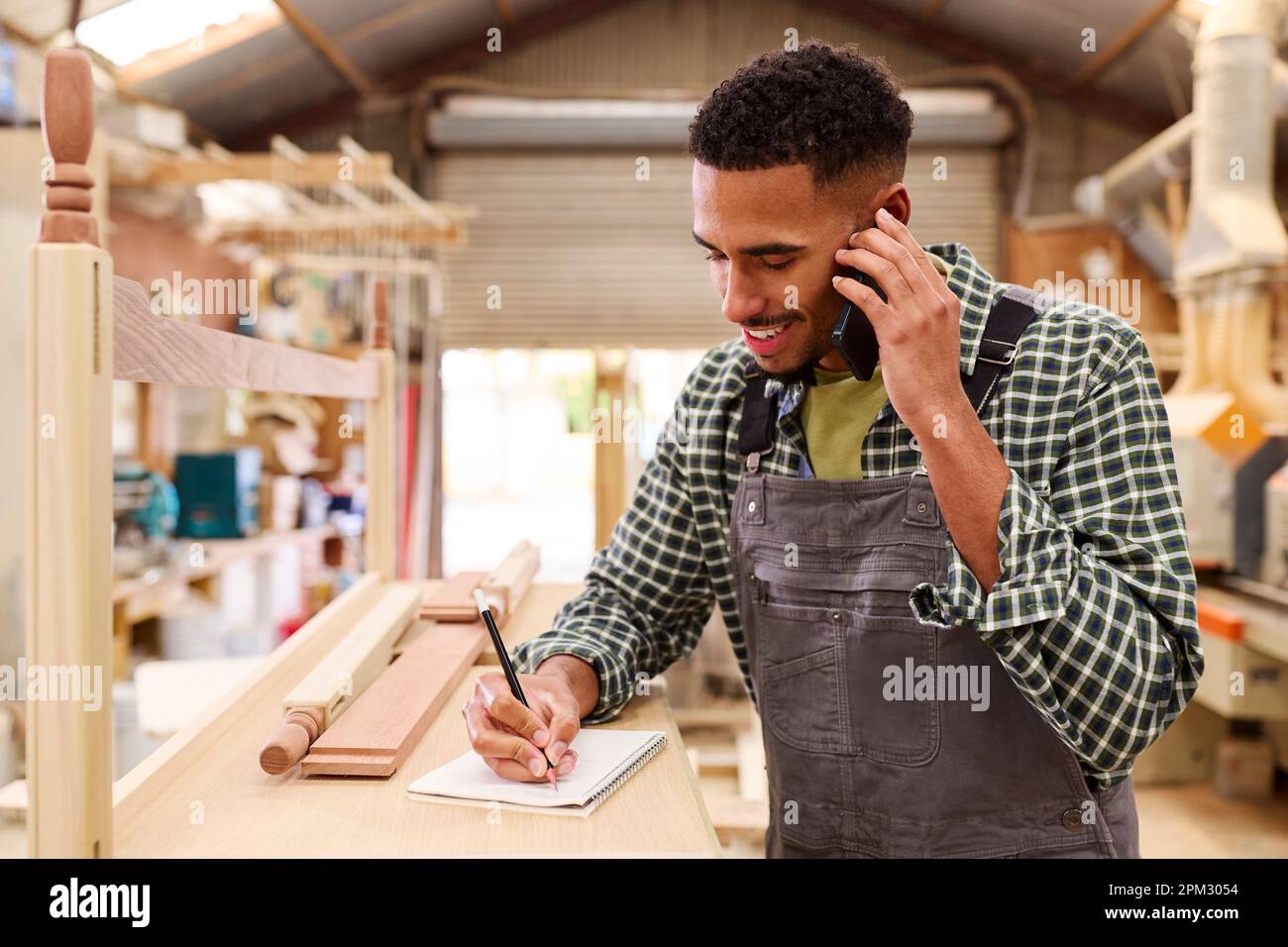 Male apprentice working carpenter in hi-res stock photography and ...