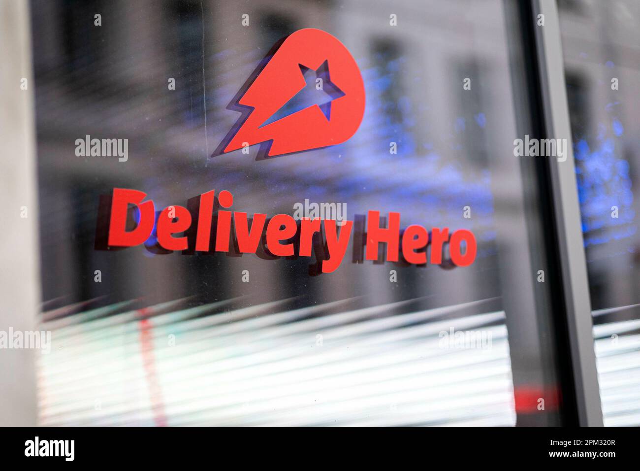 A logo of the company delivery hero at their company headquarters in ...