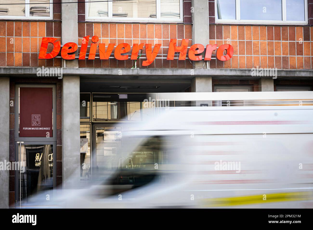 A logo of the company delivery hero at their company headquarters in ...
