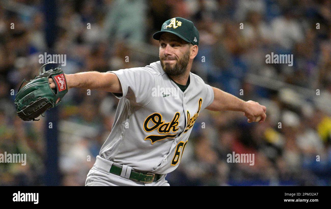 Oakland Athletics relief pitcher Sam Moll (60) throws to home plate ...