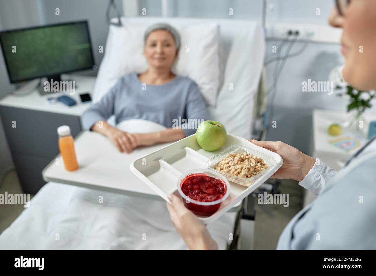 Close-up of nurse carrying tray with healthy food for sick patient ...