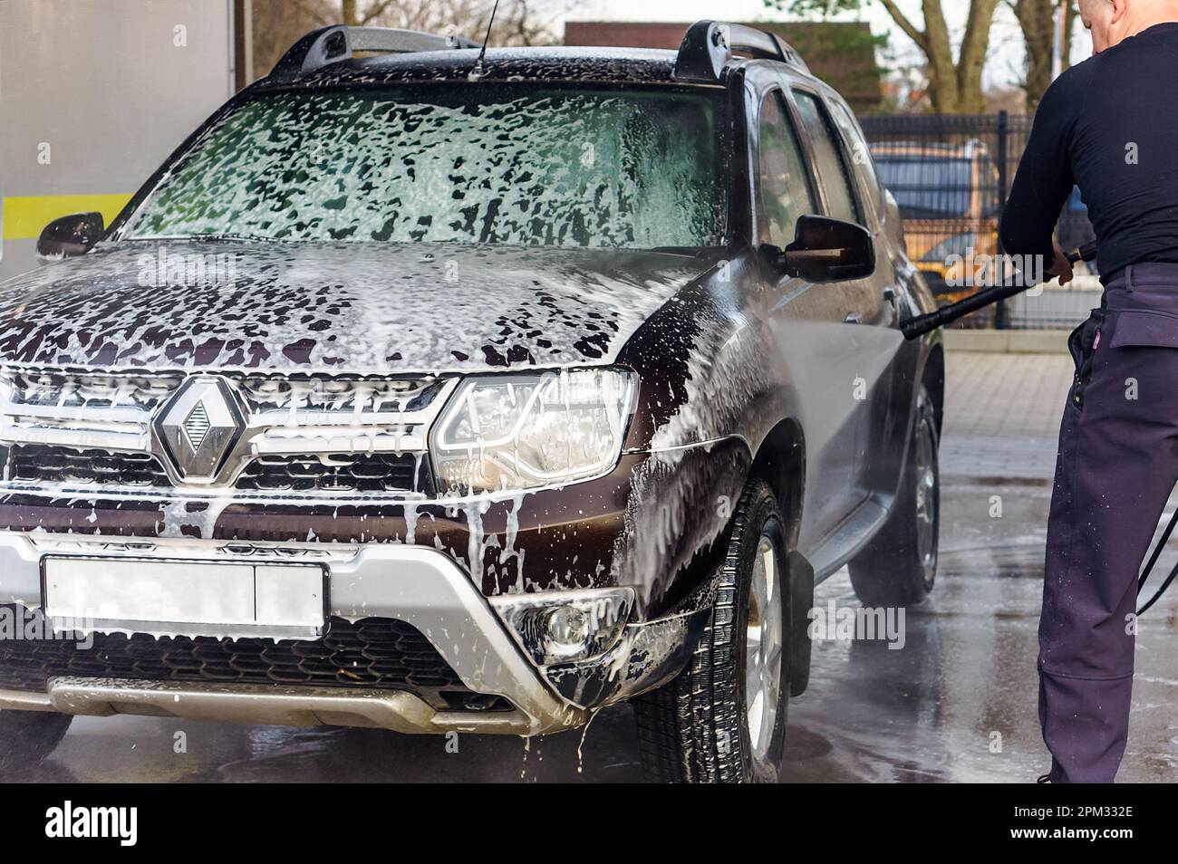 Kaliningrad, Russia, March 1, 2020. A man washes his car at a touchless ...