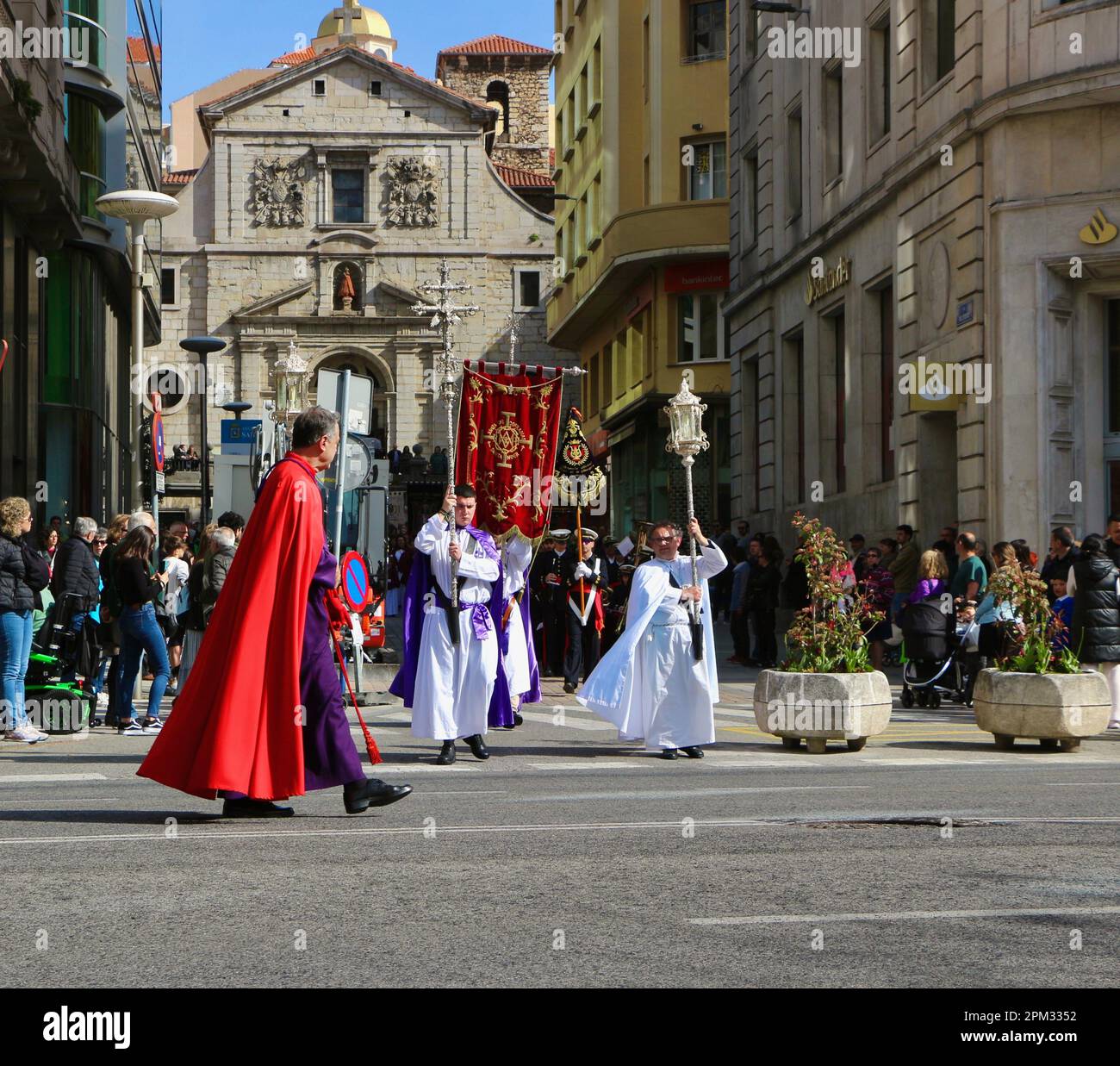 Procesión del Resucitado in traditional long robes carrying silver ...
