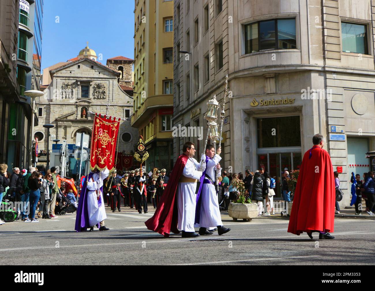 Procesión del Resucitado in traditional long robes carrying silver ...