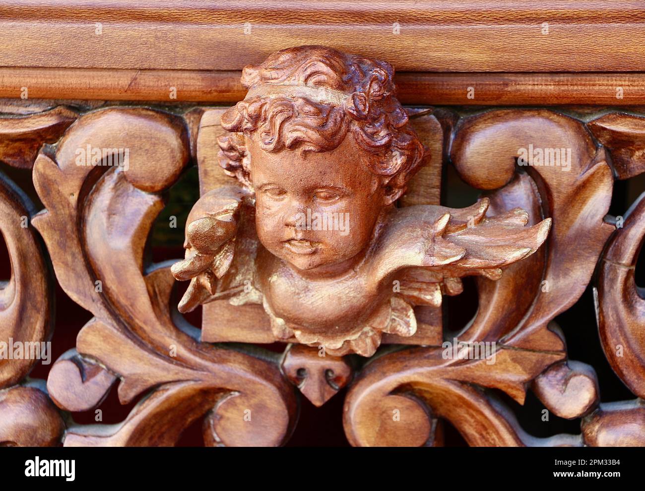 Close up of the carved wood face of a cherub on the float of Jesus ...