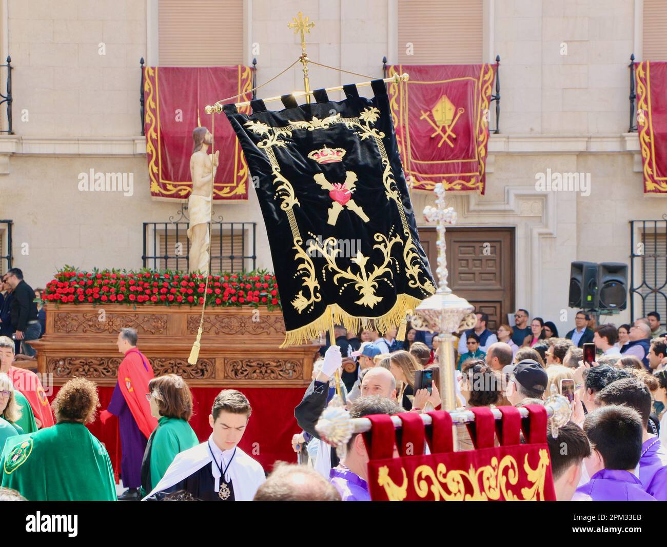 Participants in the Easter Sunday procession with a sculpture of Jesus ...