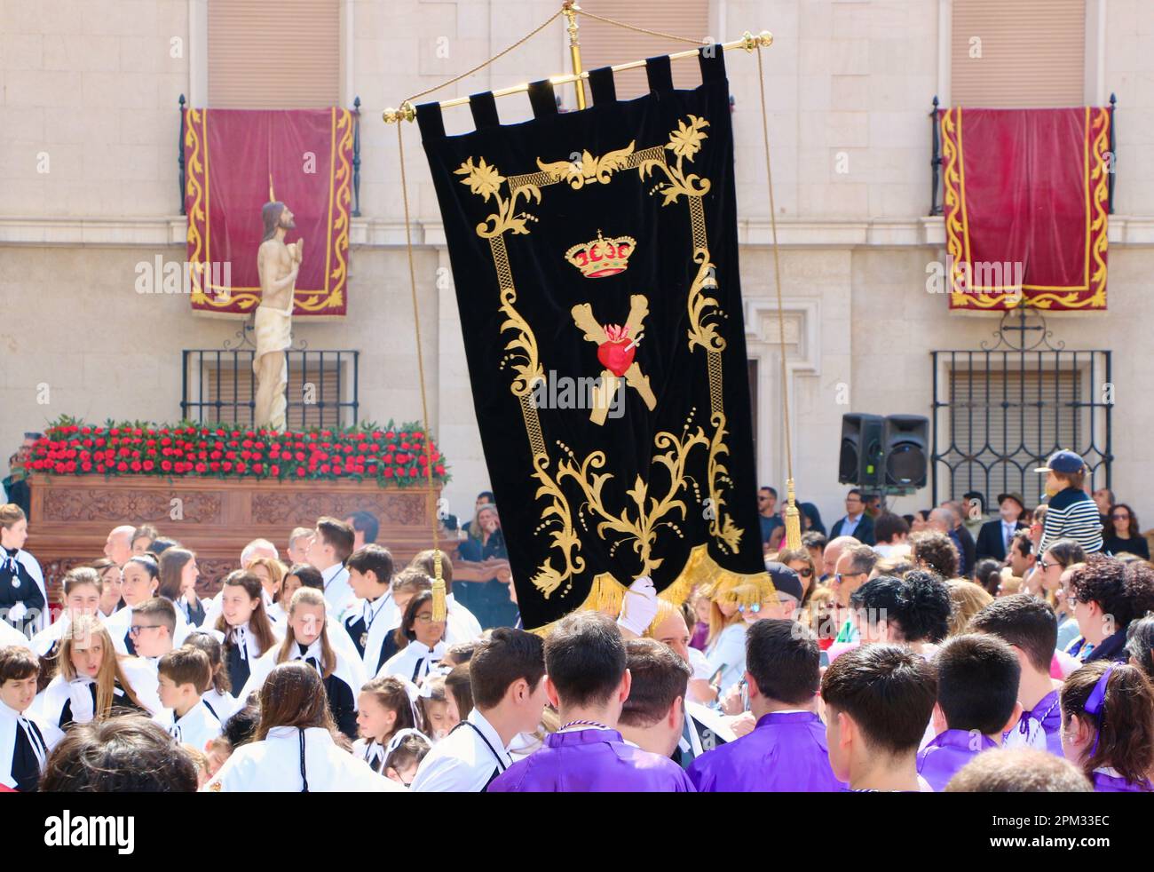 Participants in the Easter Sunday procession with a sculpture of Jesus ...