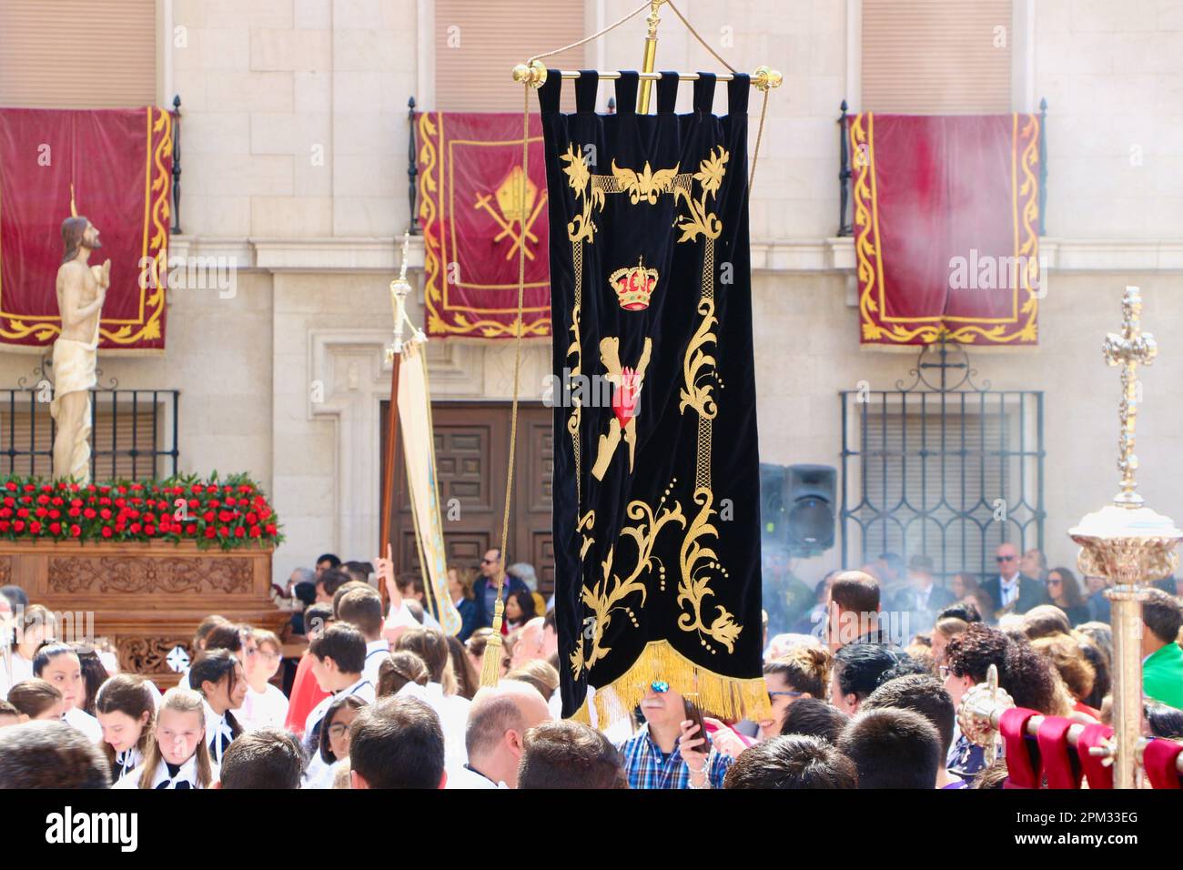Participants in the Easter Sunday procession with a sculpture of Jesus ...