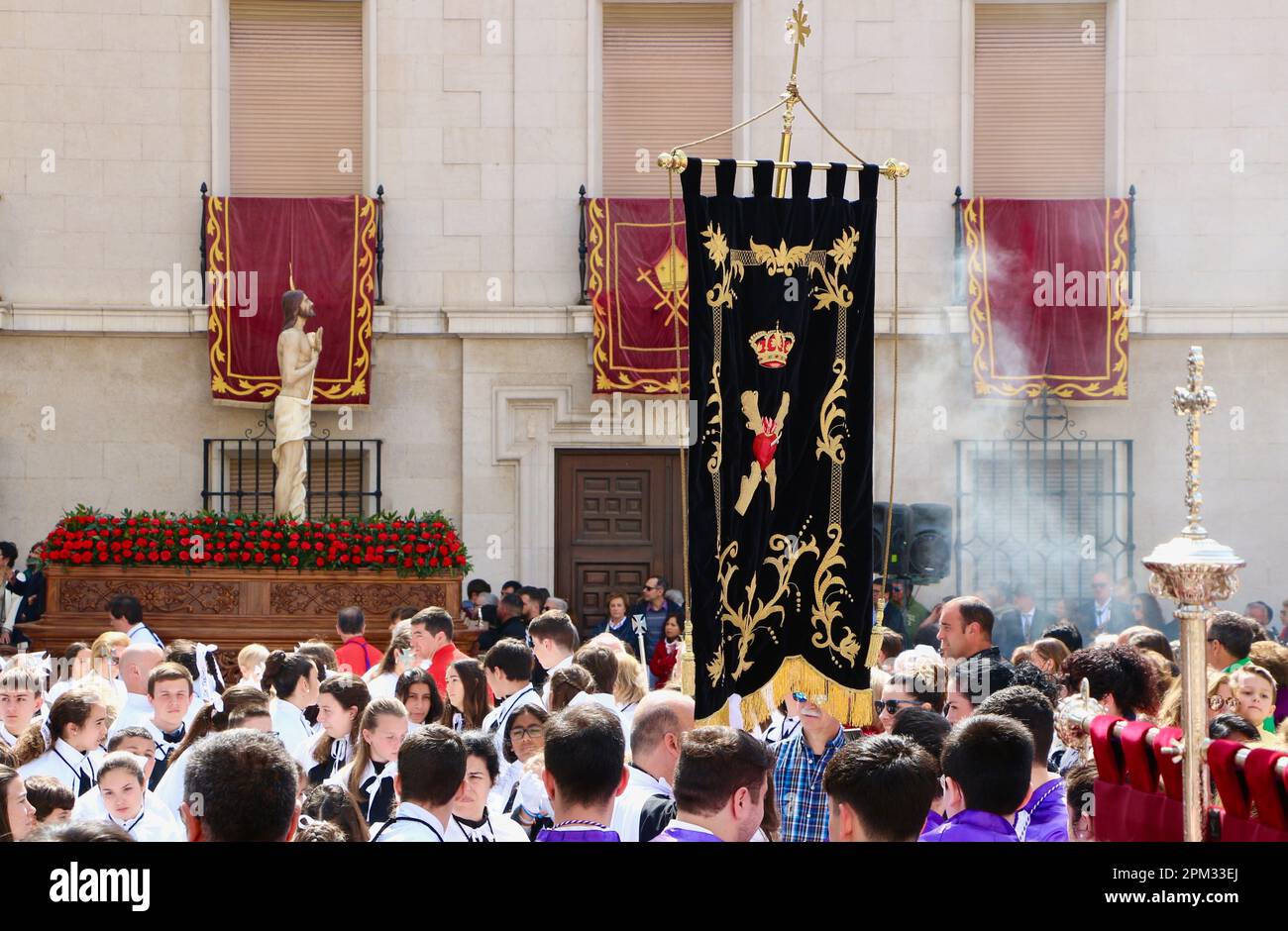 Participants in the Easter Sunday procession with a sculpture of Jesus ...