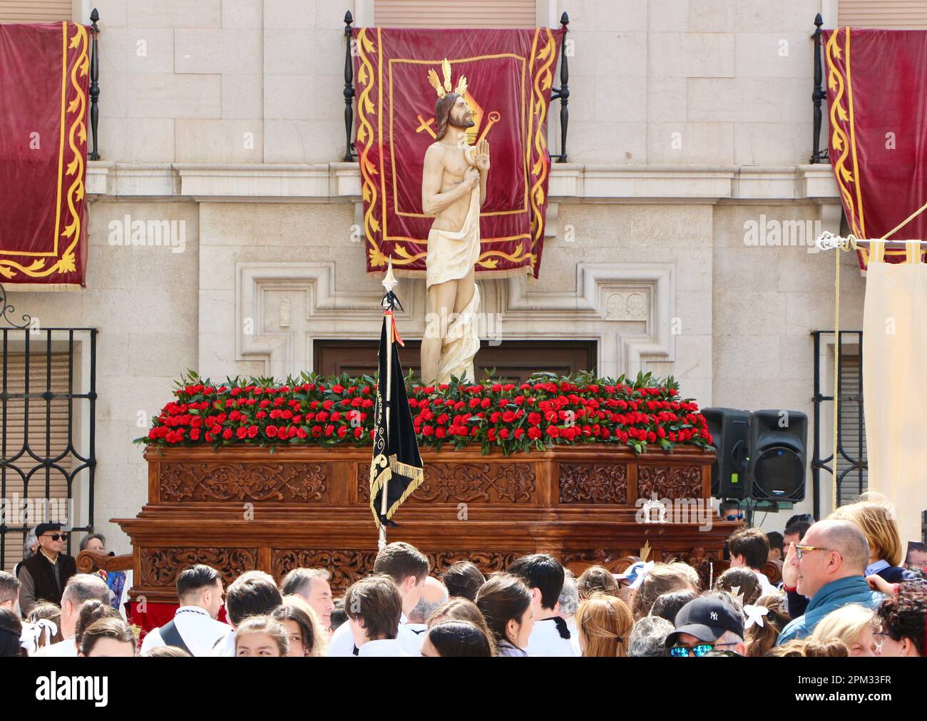 Participants in the Easter Sunday procession with a sculpture of Jesus ...