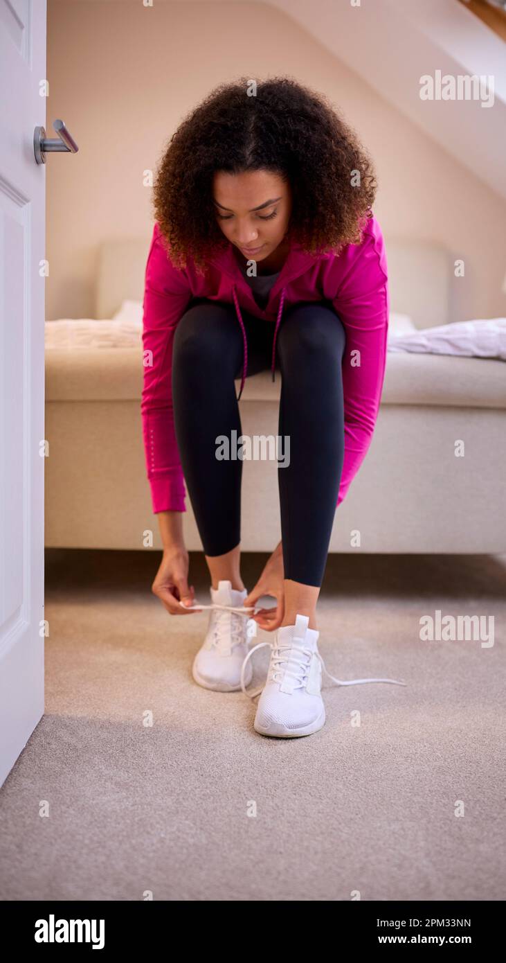 Woman getting dressed in bedroom hi-res stock photography and images ...